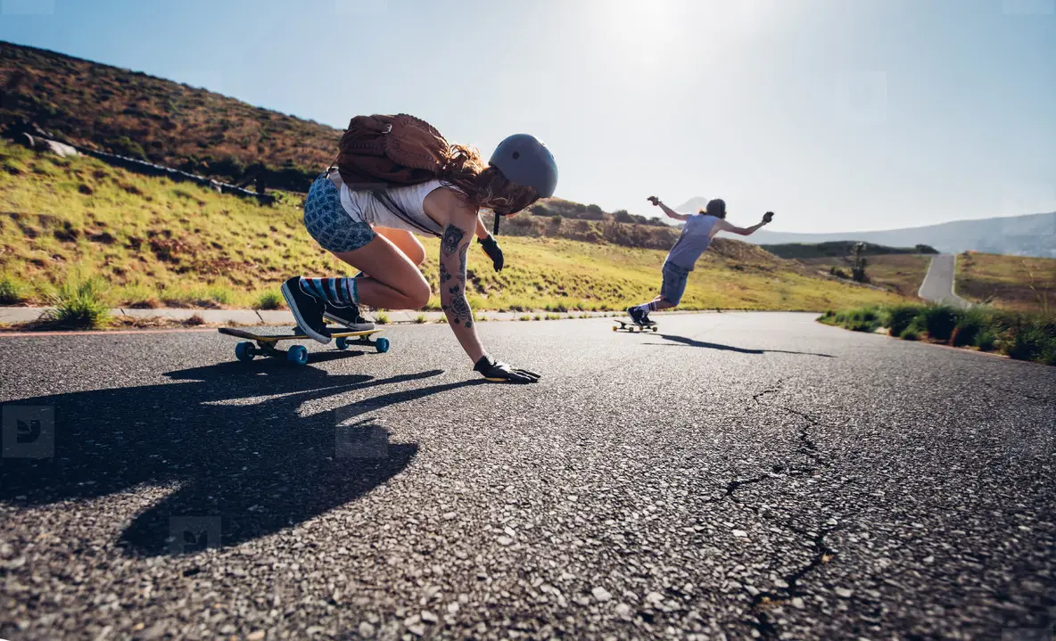 Young People Skateboarding Outdoors On The Road Photo (121586 ...