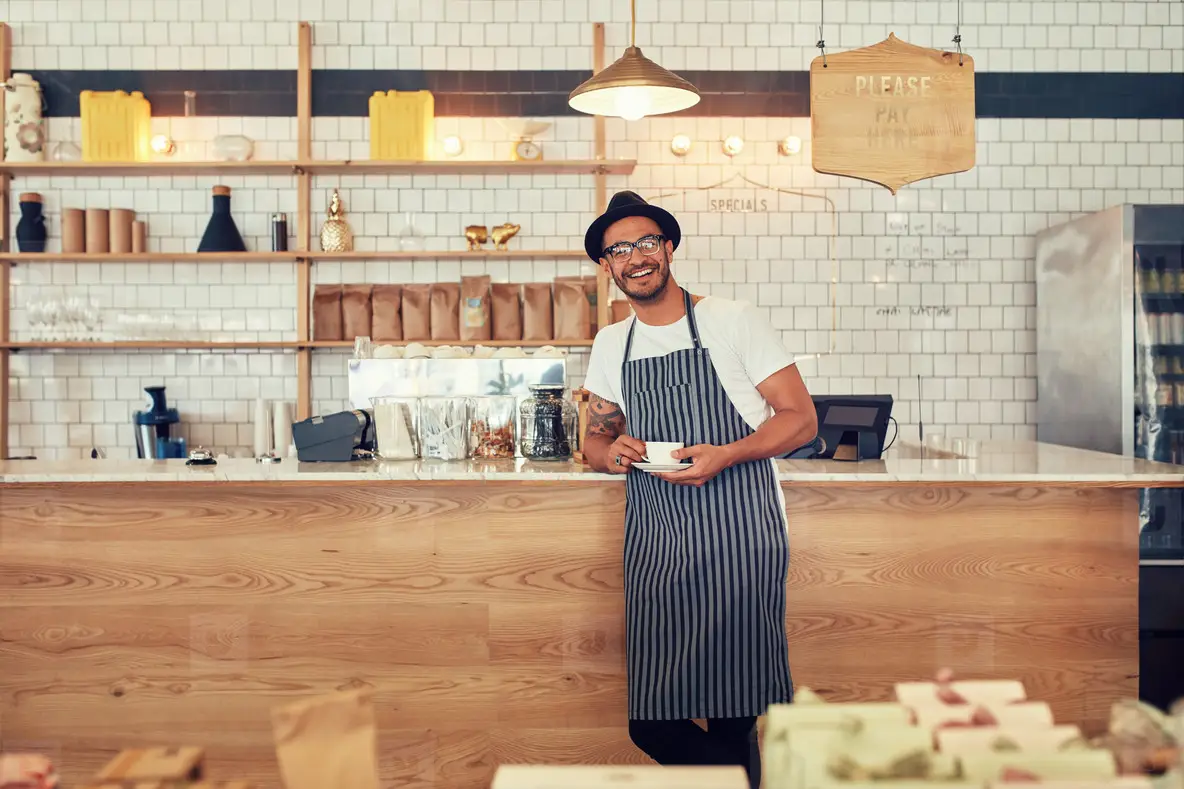 Happy Young Coffee Shop Owner Photo (121609) - YouWorkForThem