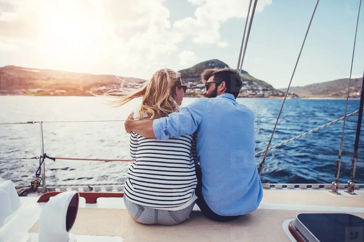 Romantic Young Couple On A Boat Trip Photo (121925) - YouWorkForThem