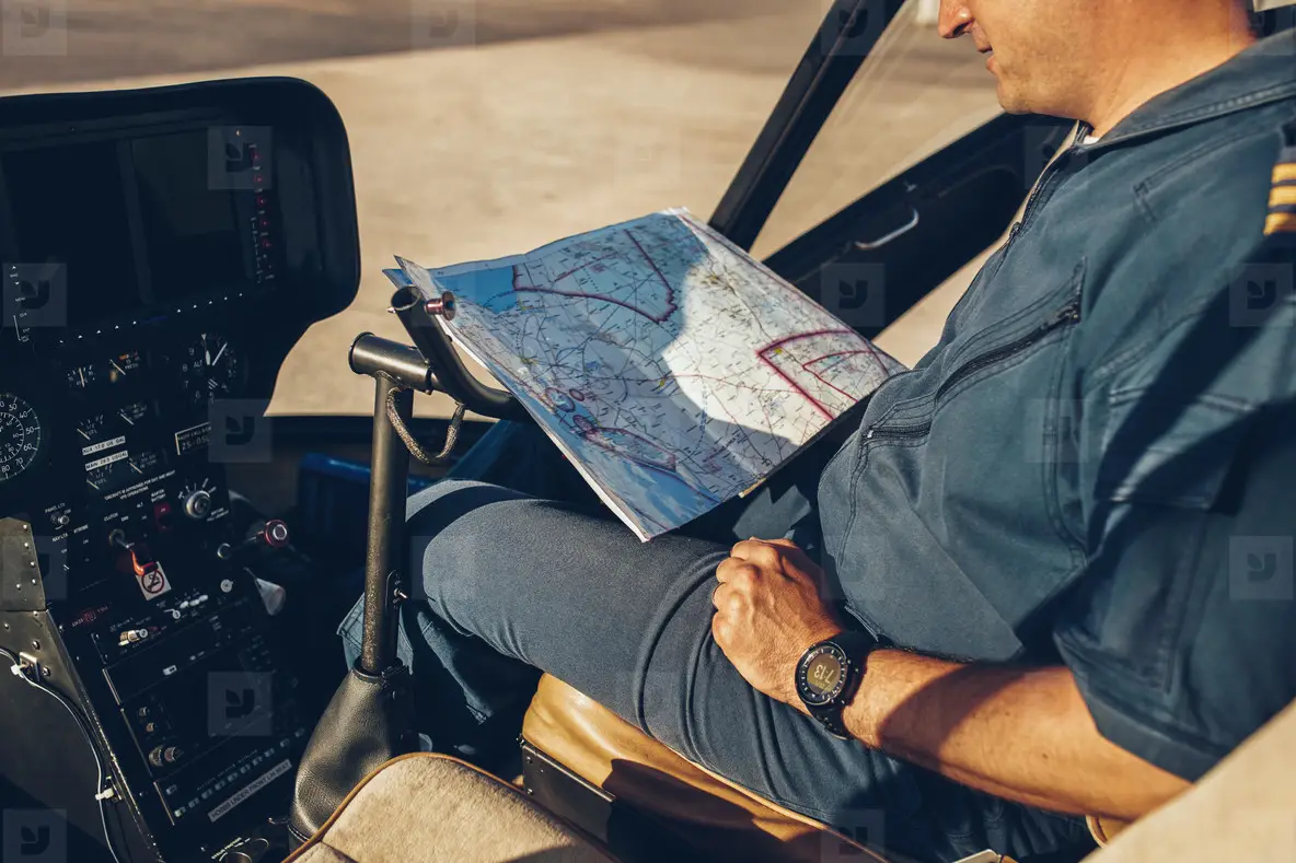 Helicopter Pilot Reading Map Photo (122685) - YouWorkForThem