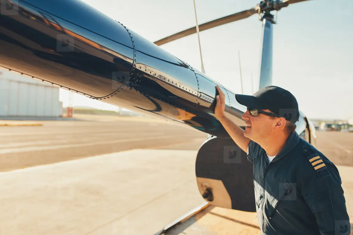 Mechanic Checking Helicopter Before Take Off Photo (122693 ...