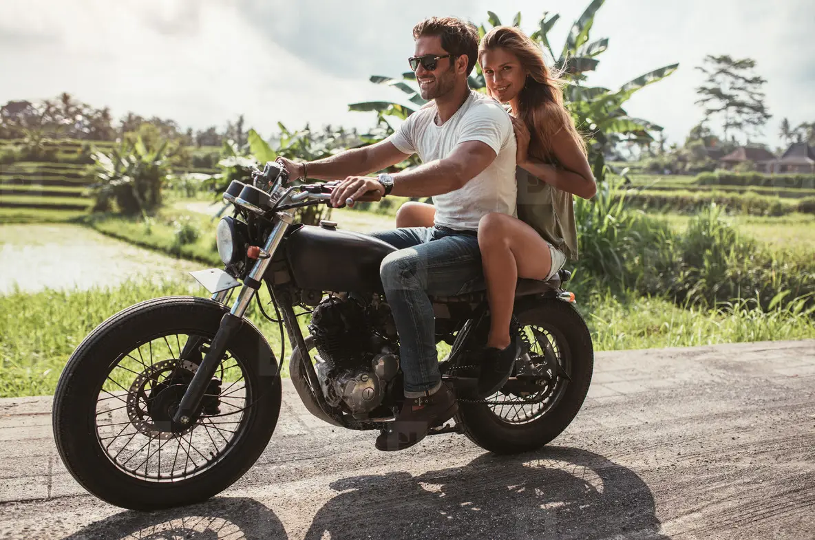 Young Couple Enjoying Motorcycle Ride On Country Road Photo (124025 ...