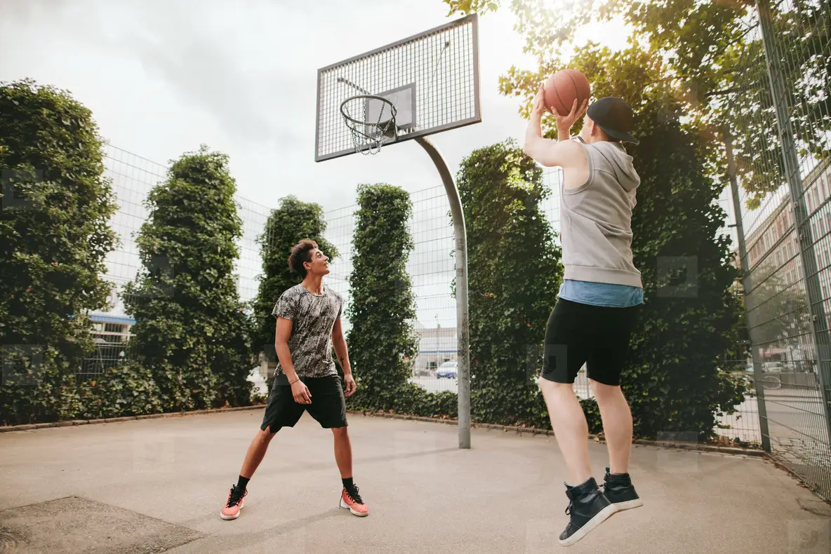 Two Friends Playing Basketball On Court Photo (124206) - YouWorkForThem