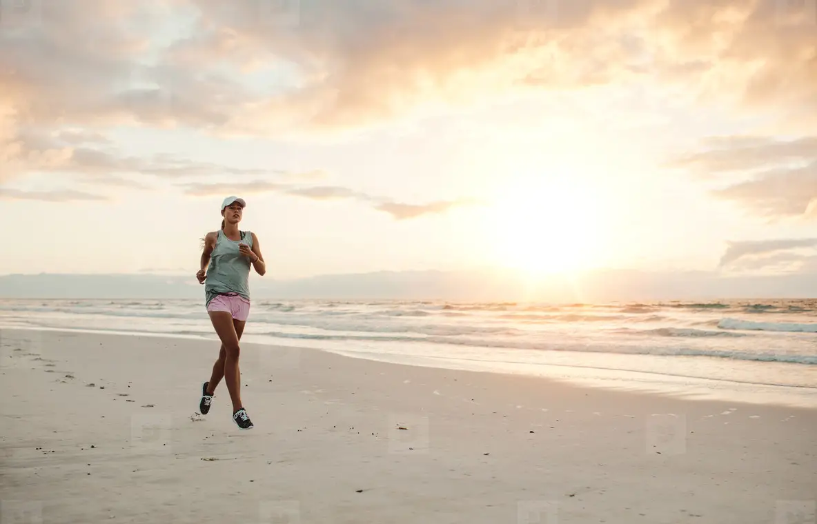 Fit Woman Running On The Beach In Morning Photo (124708) - YouWorkForThem