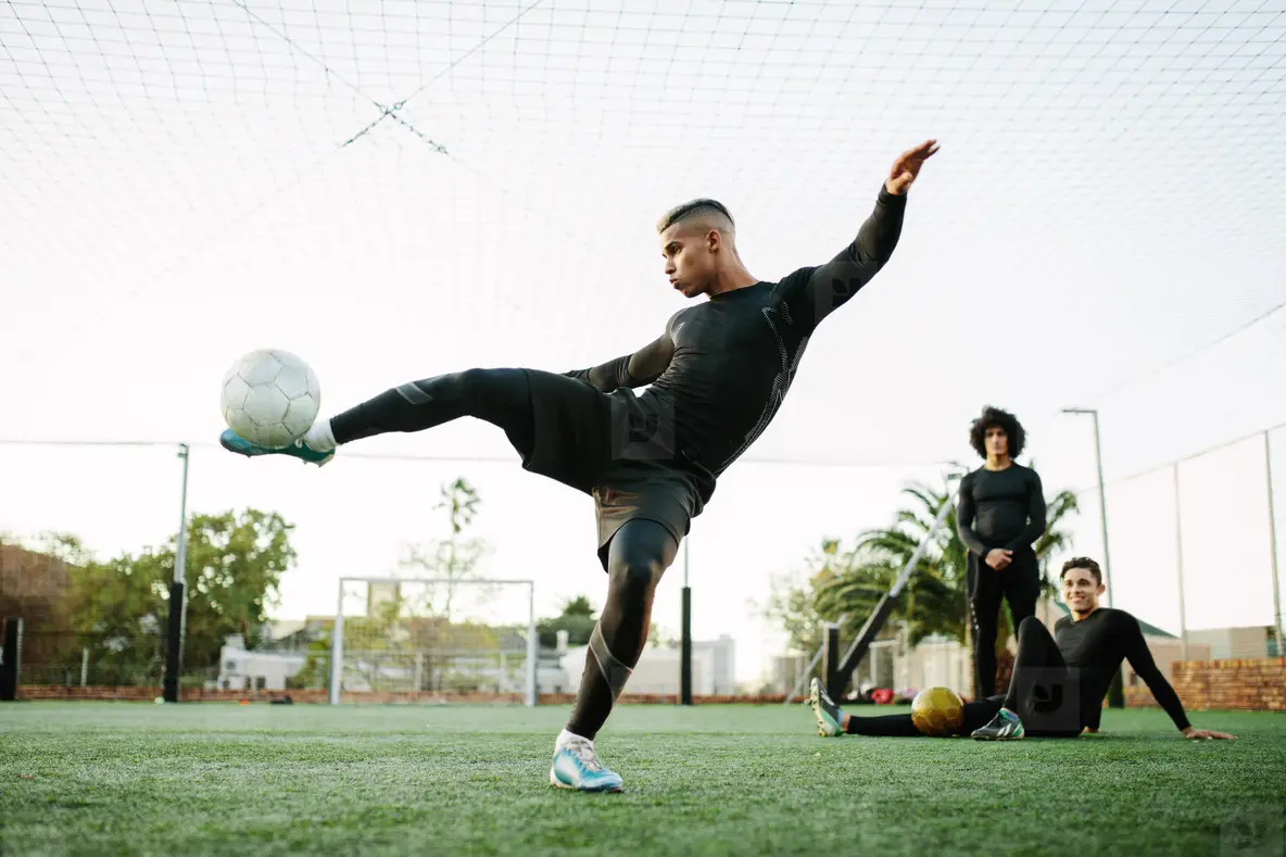 Soccer Player Kicking Ball
