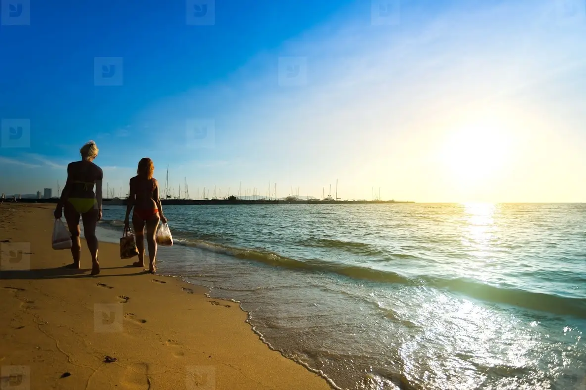 Unidentified Foreign Tourists Wear Bikinis Walk On The Beach San Photo ...