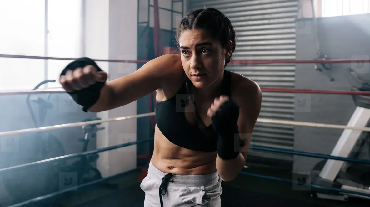 Female Boxer Training Inside A Boxing Ring Photo (133751) - YouWorkForThem