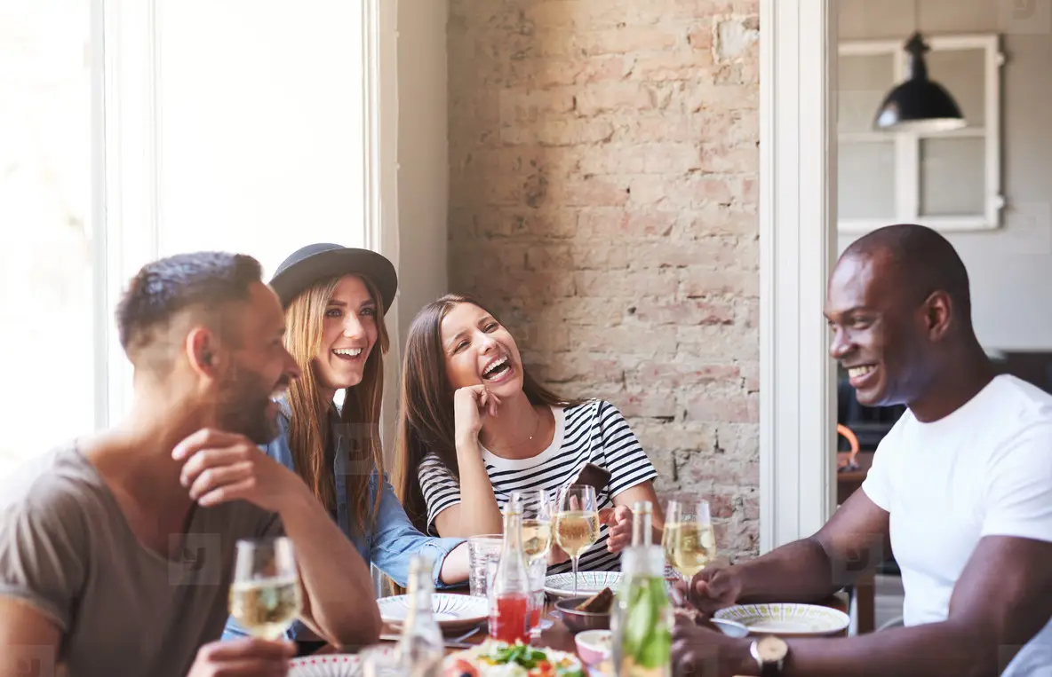 Four Happy Friends Having Wine And Dinner Together Photo (136004 ...