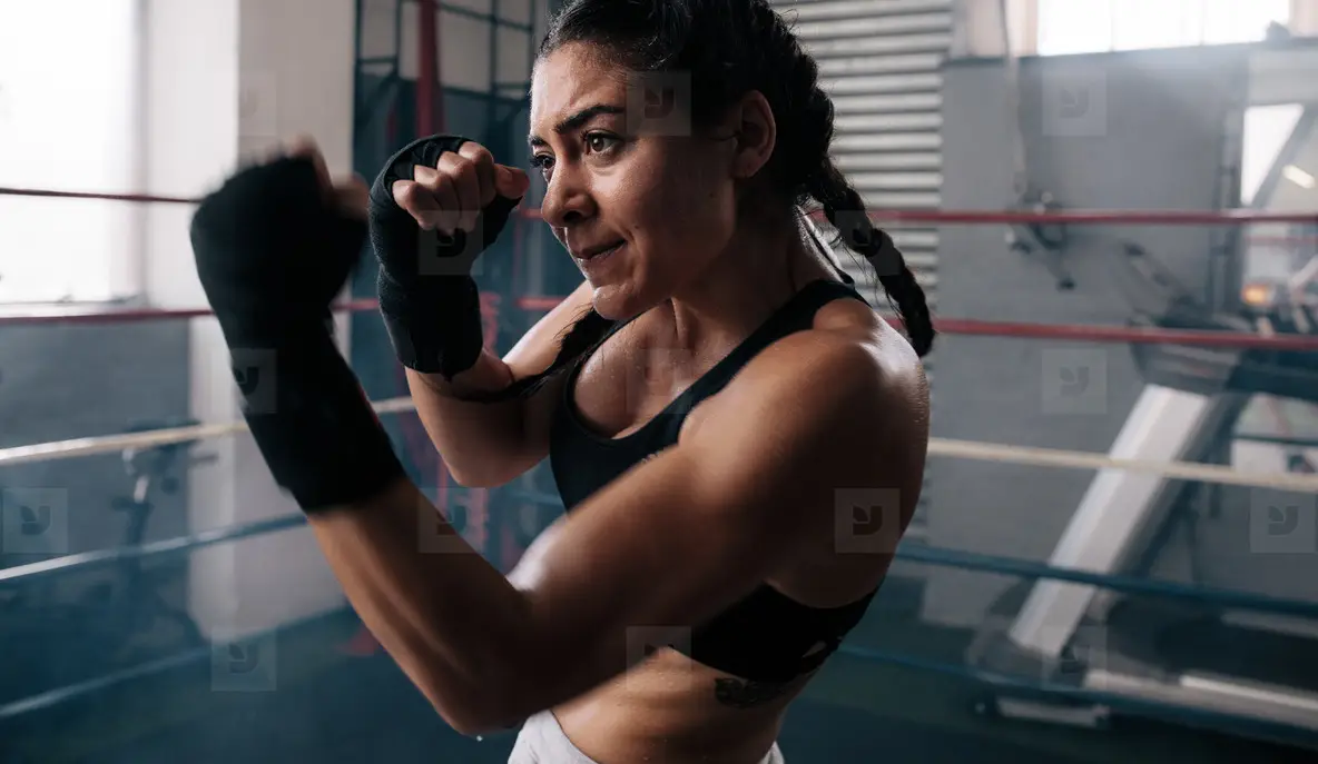 Female Boxer Training Inside A Boxing Ring Photo (139546) - YouWorkForThem