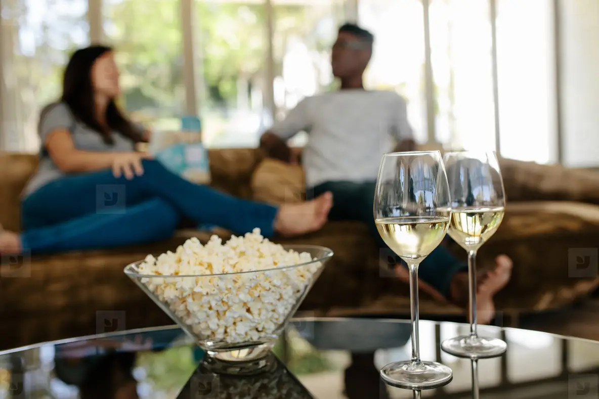 Popcorn And Drinks With Couple Relaxing In Background Photo (139696 ...