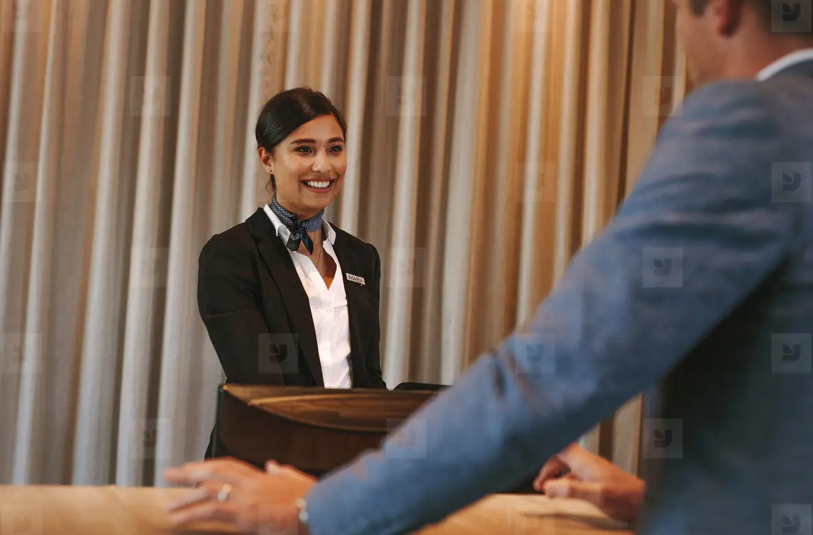 Concierge Helping Guest With Hotel Room Bookings Photo (141580 ...