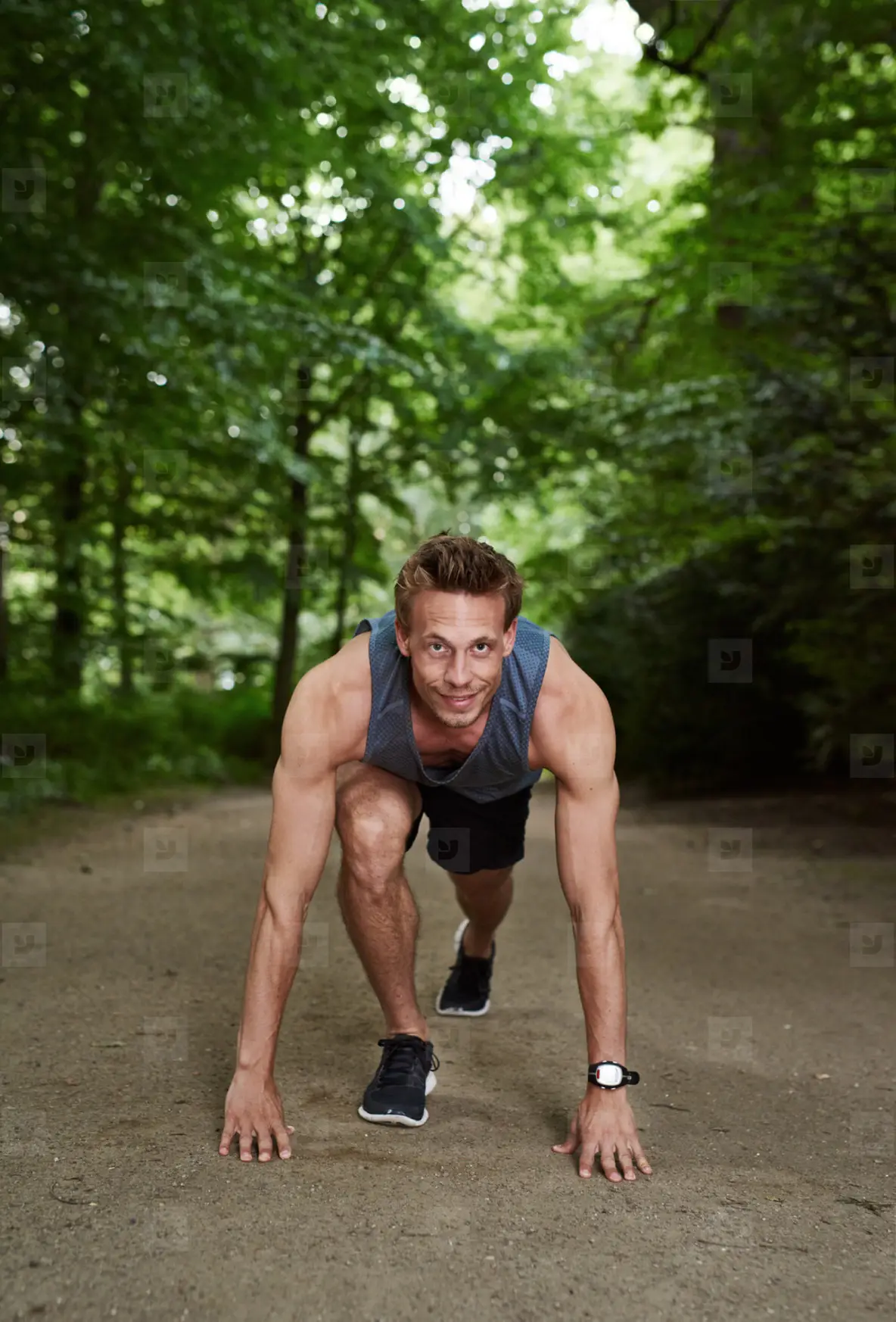 Portrait Of Male Athlete Standing In Crouch Position Photo (141951 ...