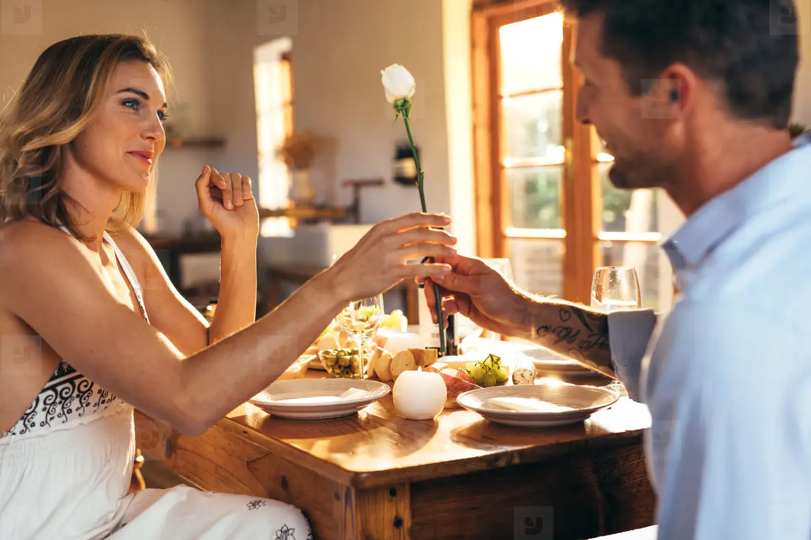 Romantic Couple Sitting At Dining Table At Home Photo (142298 ...