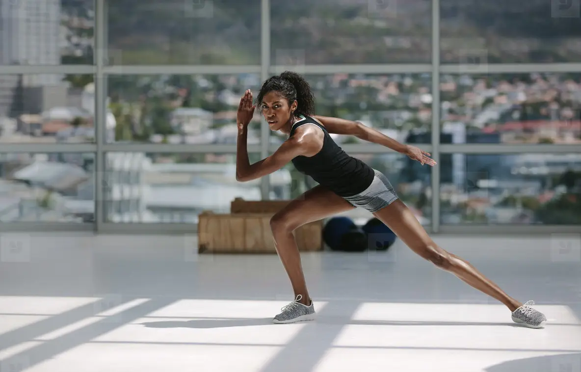 Fit Young African Woman Exercising In Gym Photo (142519) - YouWorkForThem