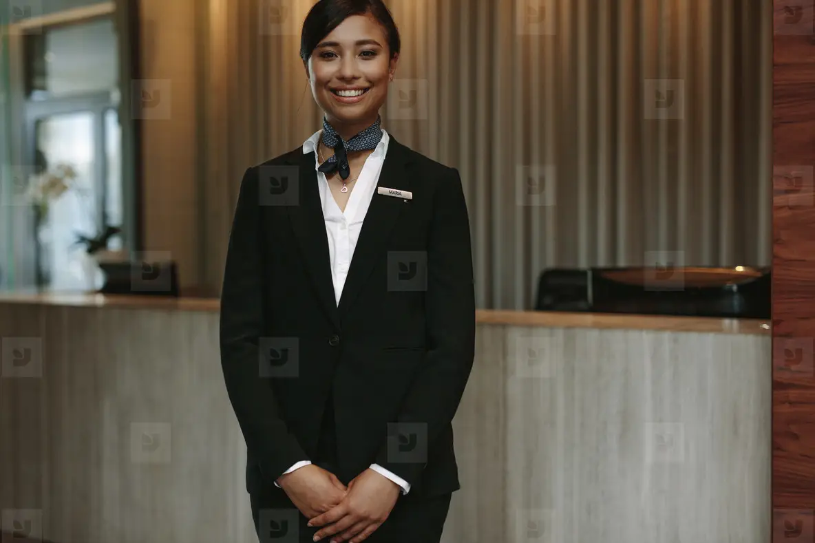 Female Concierge Ready To Welcome Guest Photo (142576) - YouWorkForThem