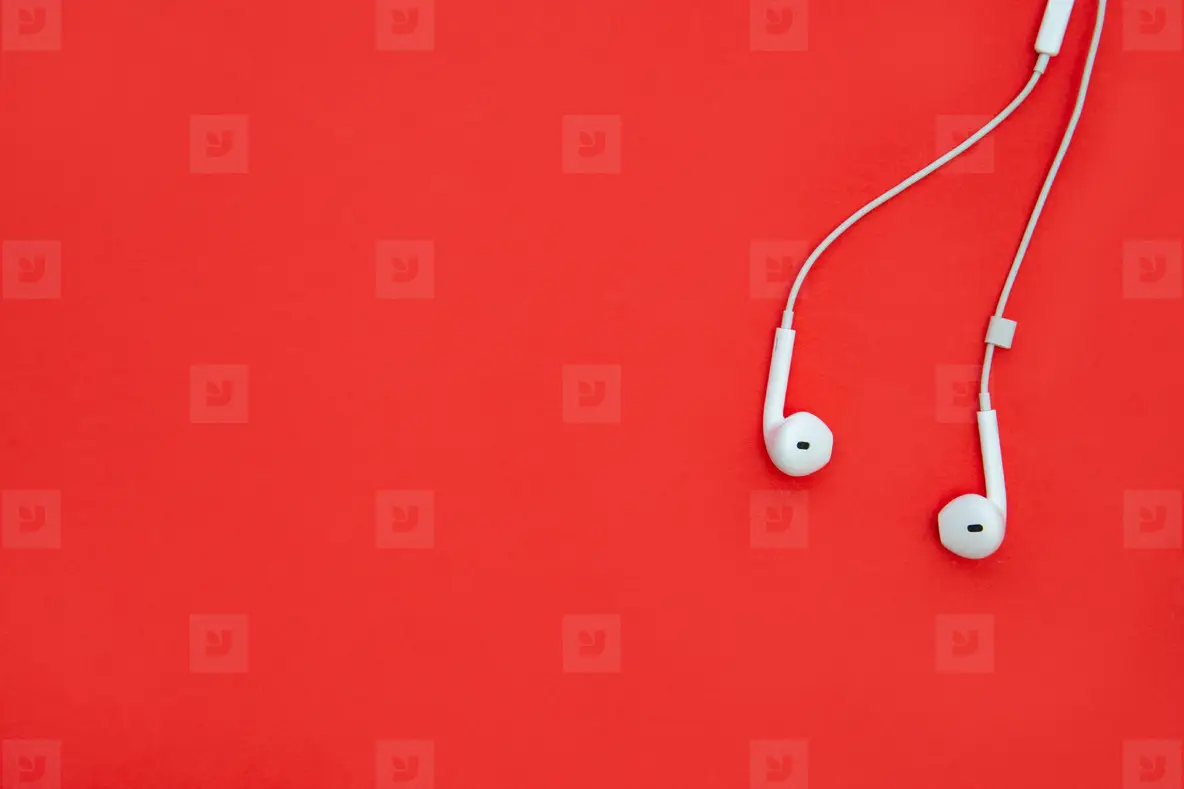 White Music Earphones Isolated On Red Background Photo (142601 ...
