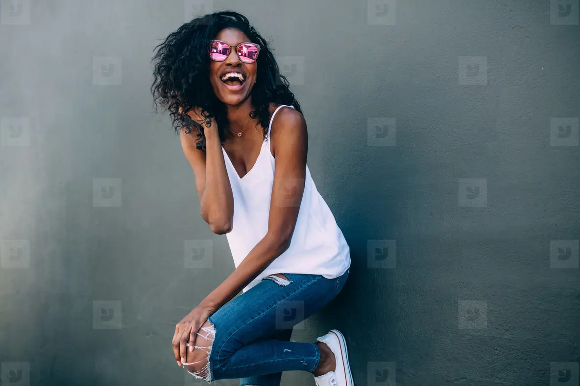 Portrait Of A Woman Standing Against A Wall Photo (143454) - YouWorkForThem