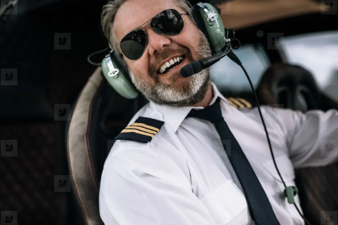 Smiling Helicopter Pilot With Headset Photo (144305) - YouWorkForThem