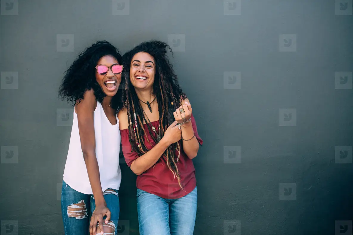 Women Standing Against A Wall And Posing Photo (145758) - YouWorkForThem