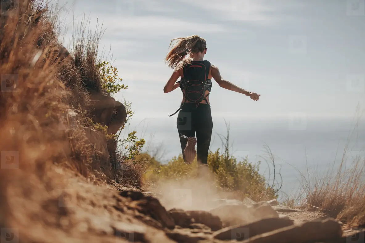 Female Running Over Rocky Trails On The Hillside Photo (149251 ...