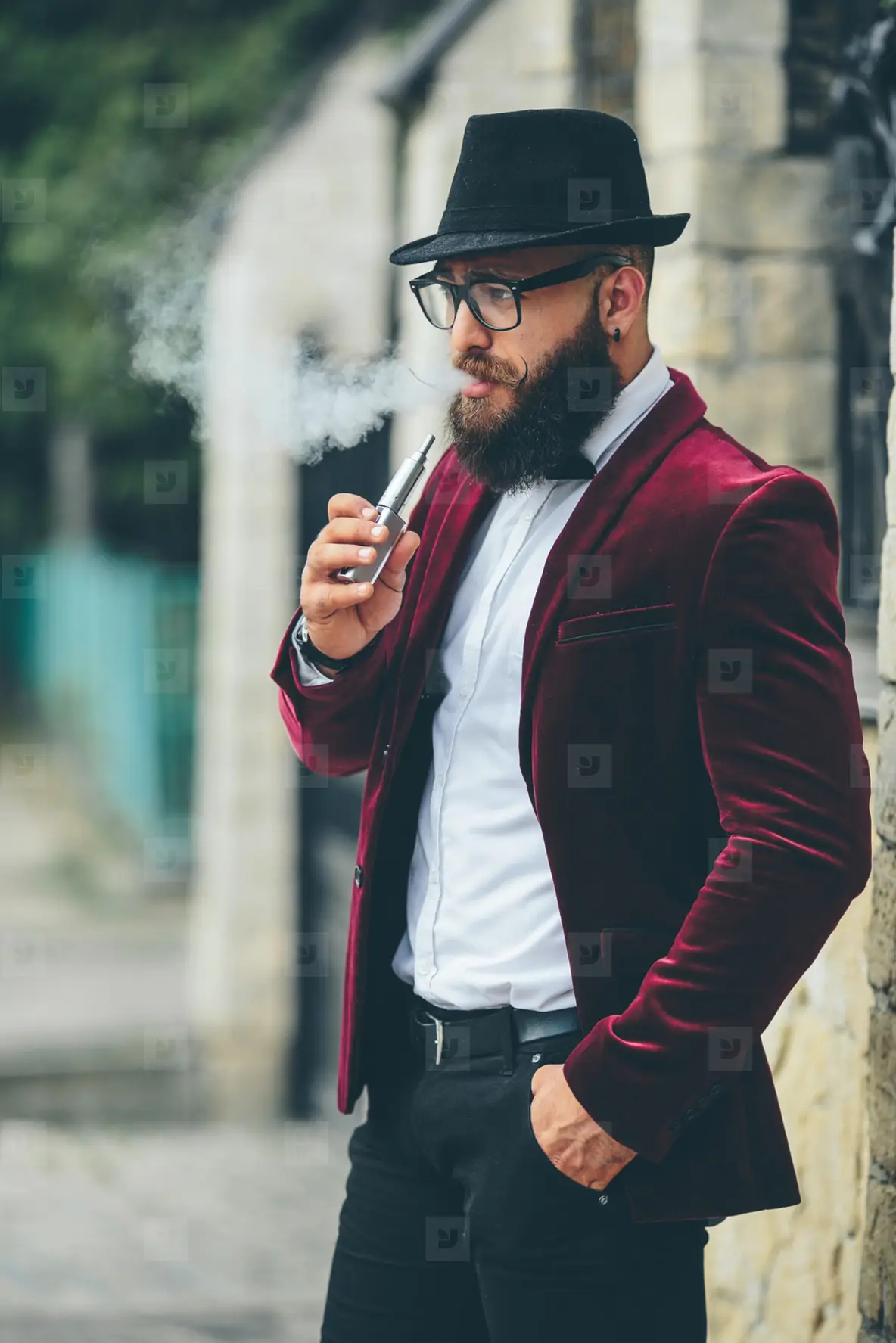 A Rich Man With A Beard Smokes Electronic Cigarette Photo (153412 ...