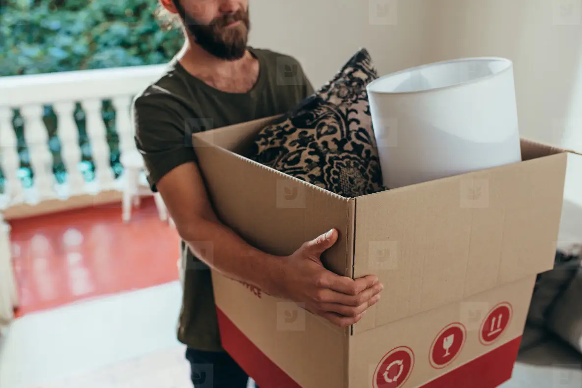 Man Carrying A Packing Box With Household Stuff Photo (154364 ...