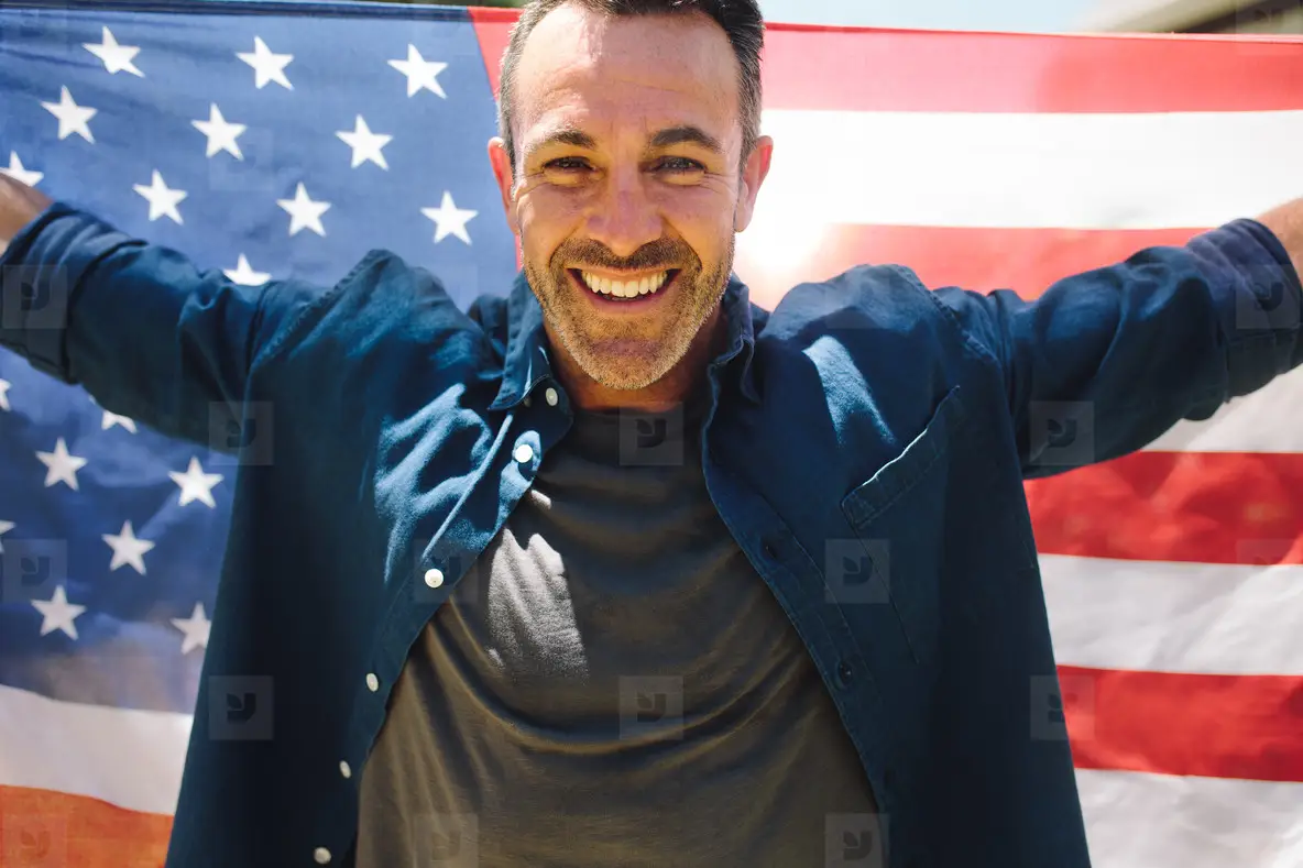 Portrait Of A Man Holding American Flag Photo (163477) - YouWorkForThem