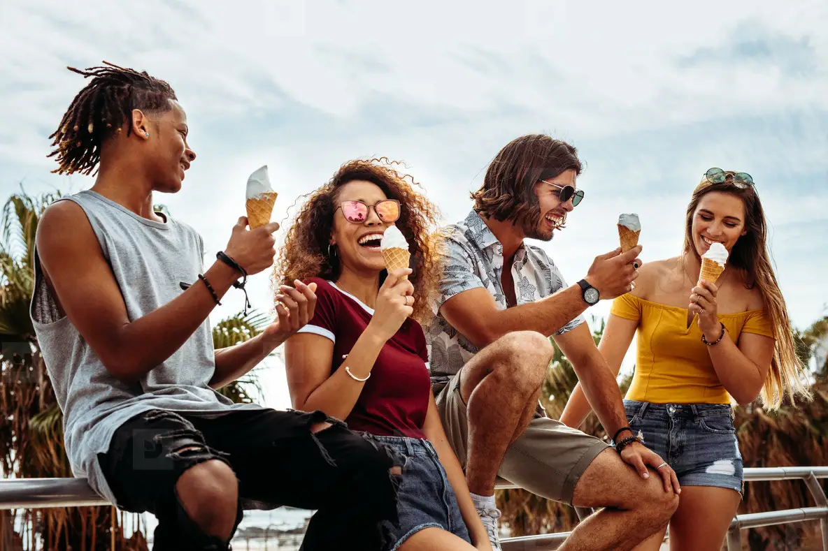 Smiling Young Friends Eating Ice-cream Outdoors Photo (163981 ...