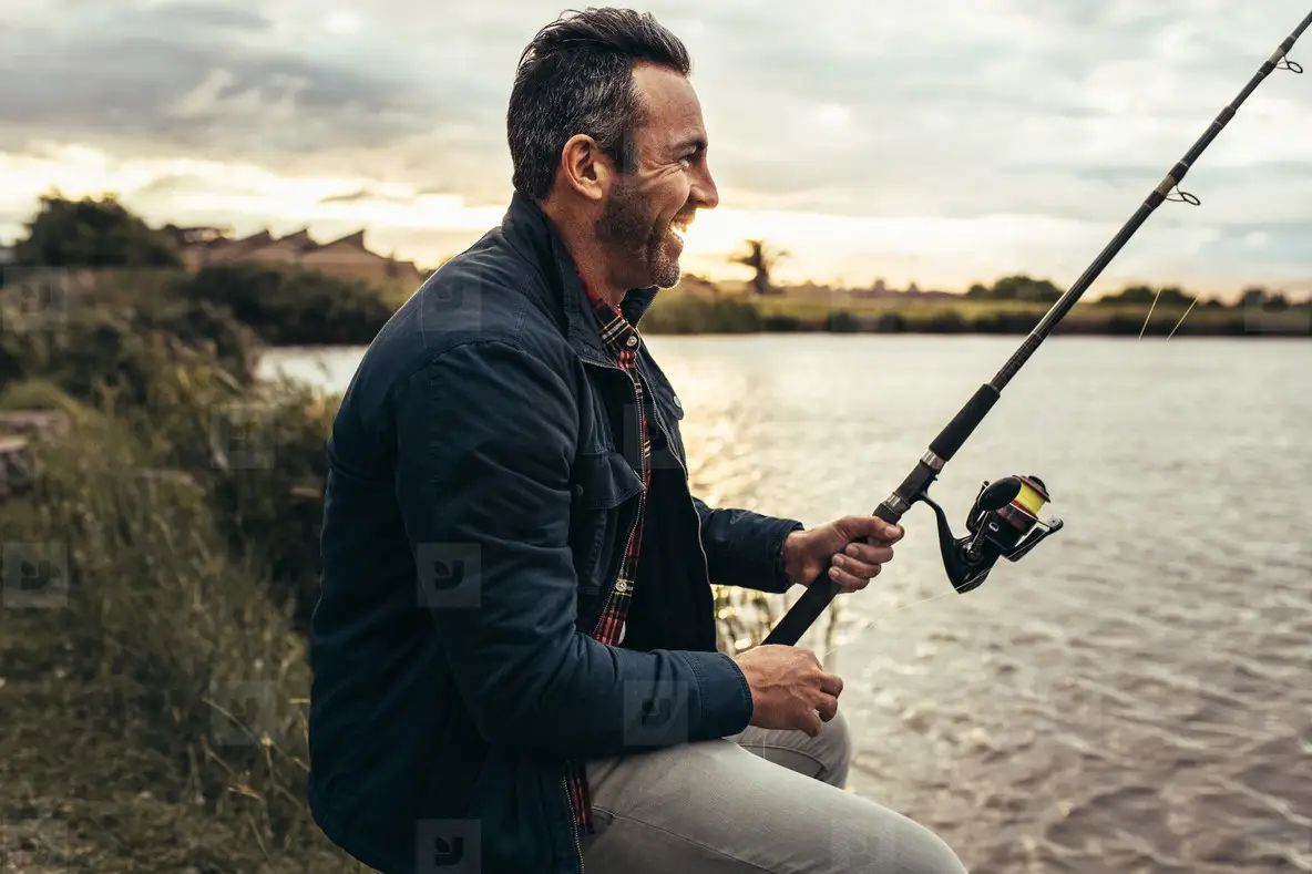 Man Enjoying Fishing Near A Lake Photo (170620) - YouWorkForThem