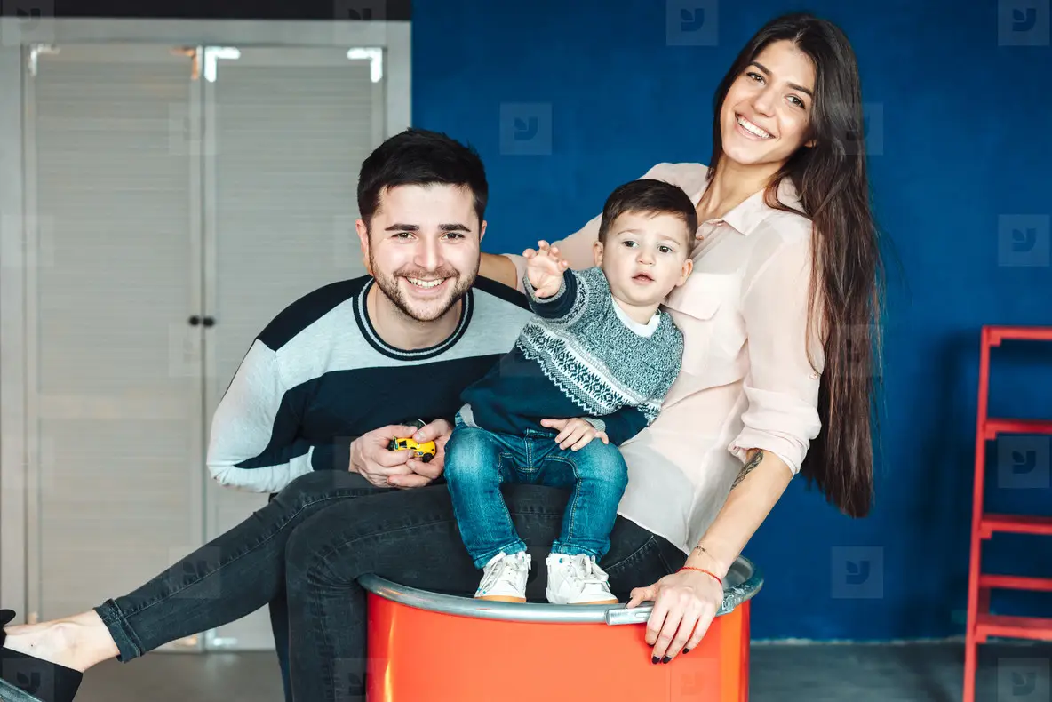 Young Family Having Fun At Home Photo (174769) - YouWorkForThem
