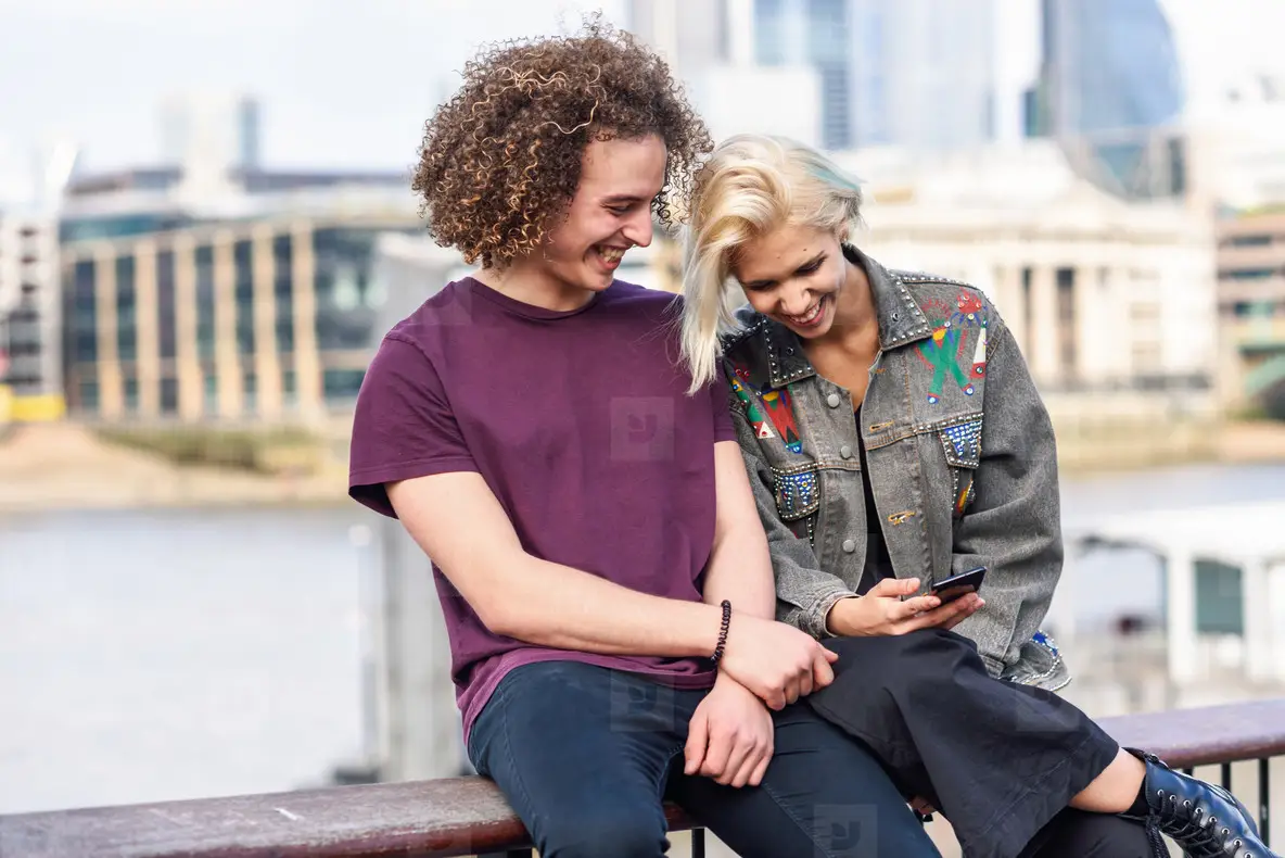 Happy Couple Talking Sitting Near River Thames Photo (182752 ...