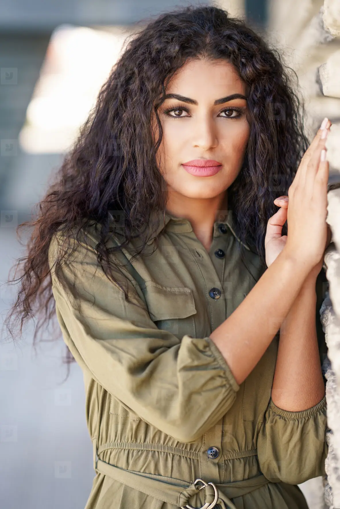 Young Arab Woman With Curly Hair Outdoors Photo (201506) - YouWorkForThem