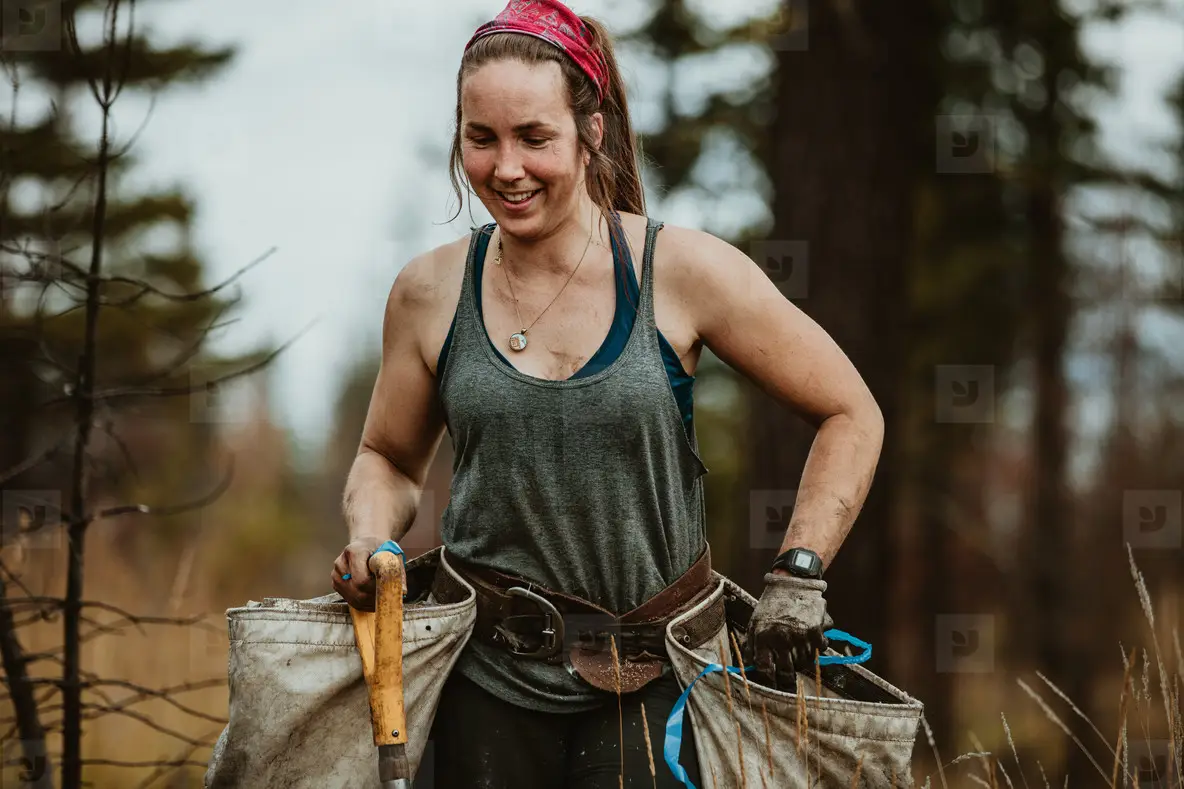 Woman Planting Trees In Forest Photo (209900) - YouWorkForThem