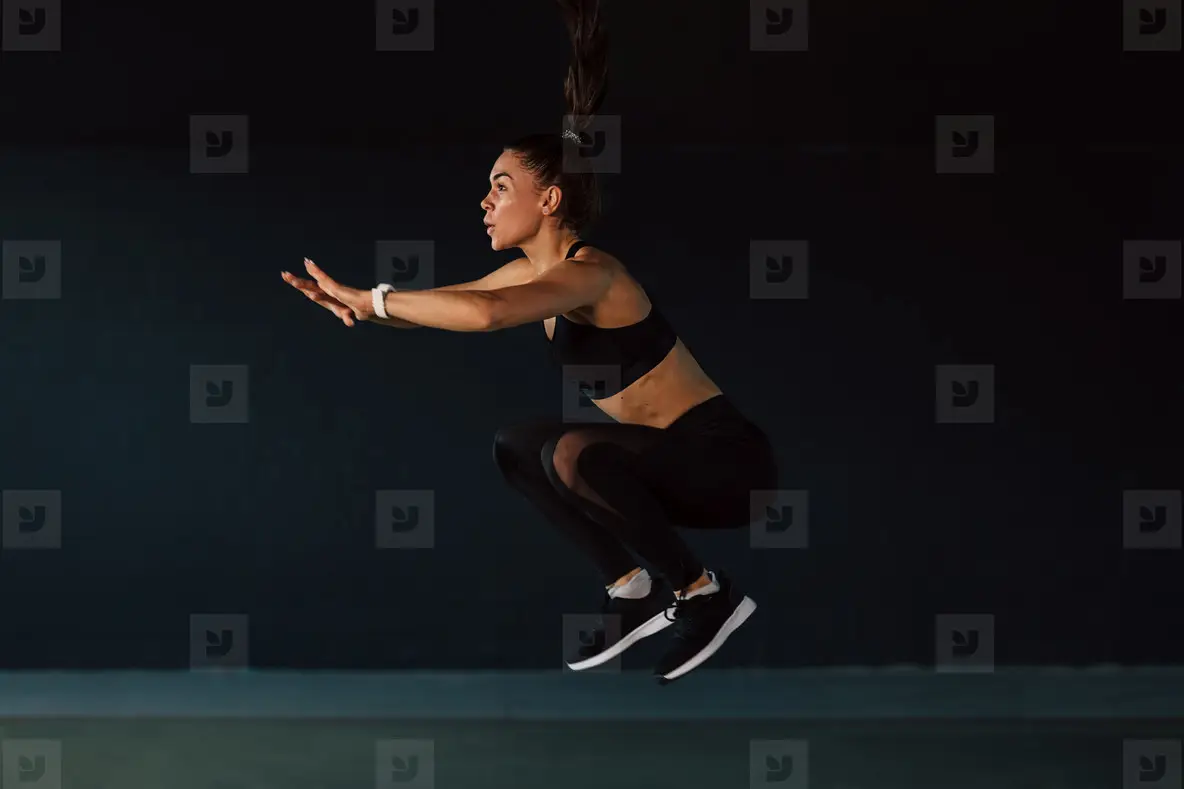 Side View Of Female Athlete Jump Photo (221788) - YouWorkForThem