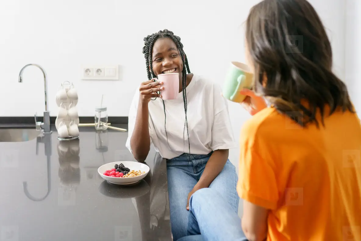 Two Friends Having A Healthy Snack While Chatting At Home Photo (228140 ...