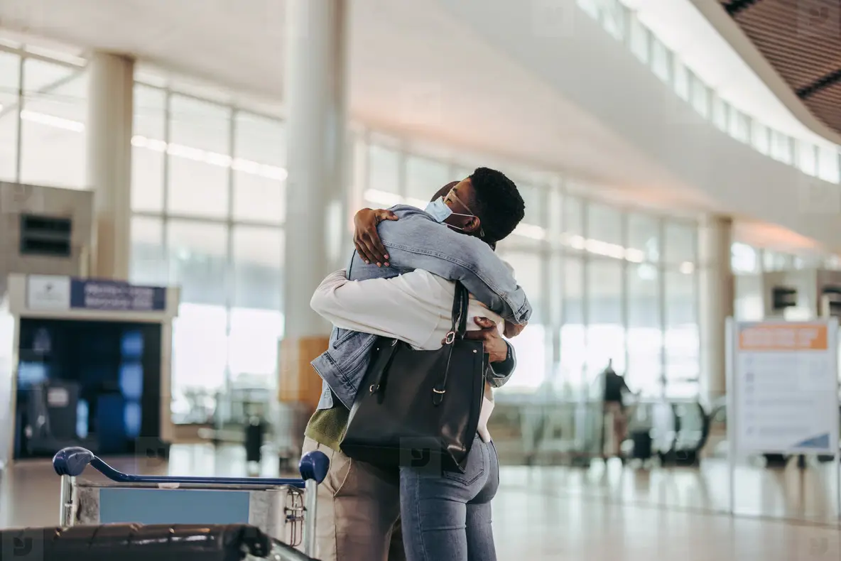 Wife Giving Good Bye Hug To Her Husband At Airport Photo (238492 ...