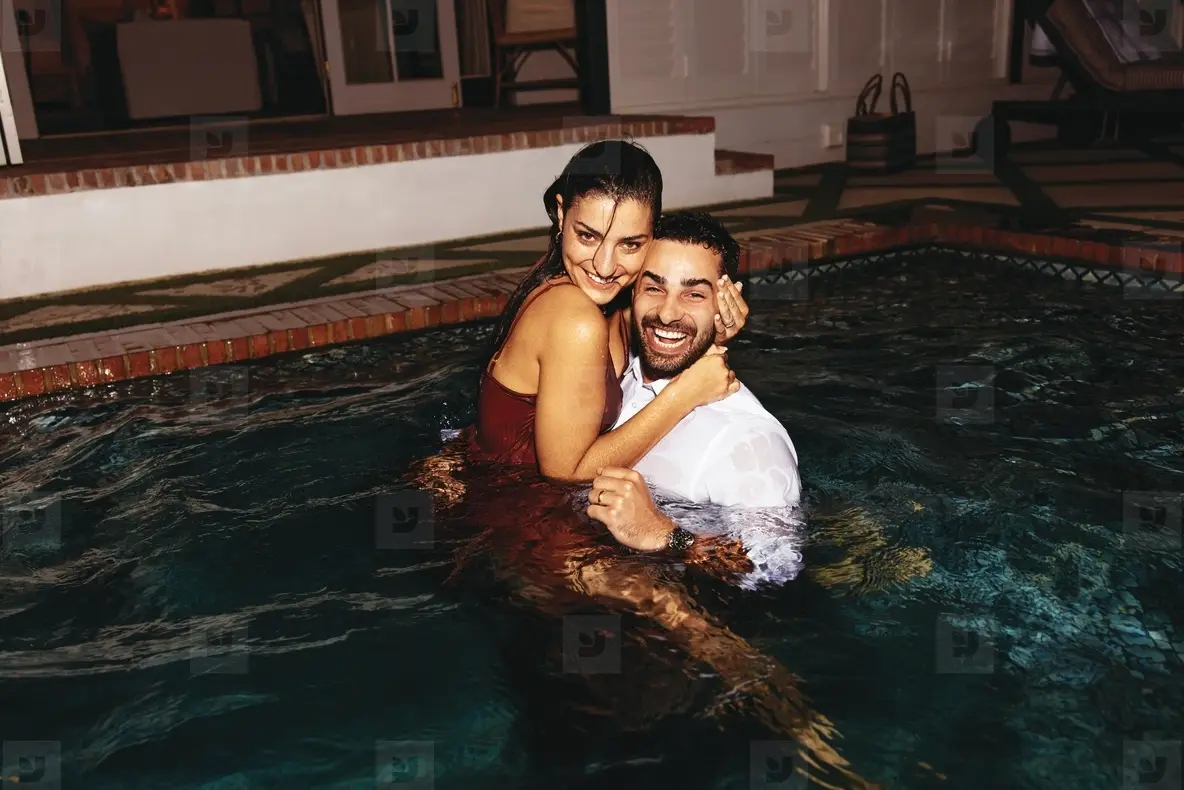 Young Couple Swimming In Their Clothes At Night Photo (245291 ...