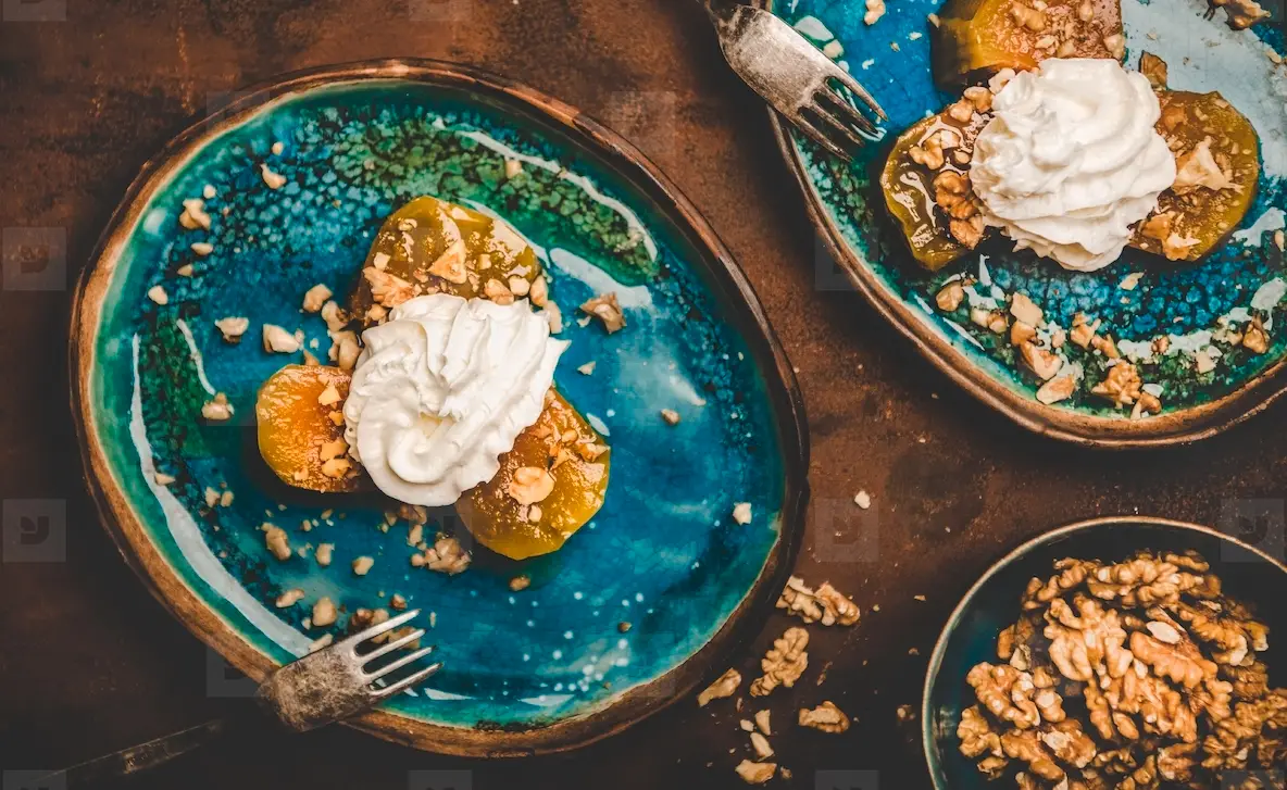 Turkish Dessert With Pumpkin In Syrup, Walnuts And Whipped Cream Photo ...