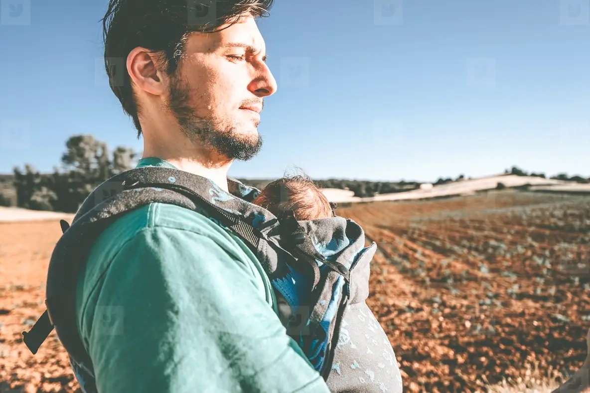 Single Male Parent Carrying Her Baby With A Backpack Photo (249990 ...