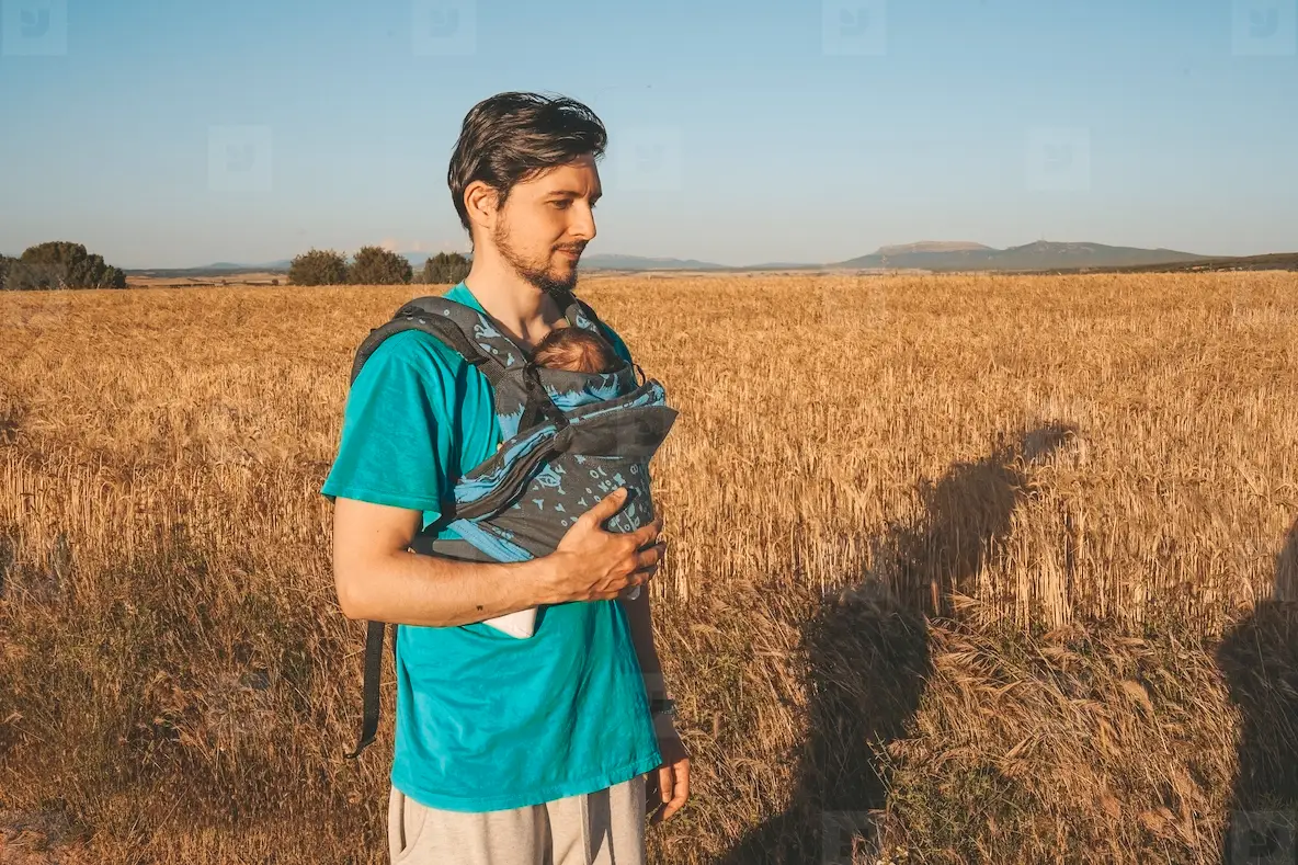 Single Male Parent Carrying Her Baby With A Backpack Photo (249993 ...