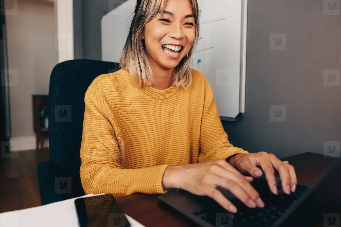 Cheerful Businesswoman Typing An Email In Her Home Office Photo (254305 ...