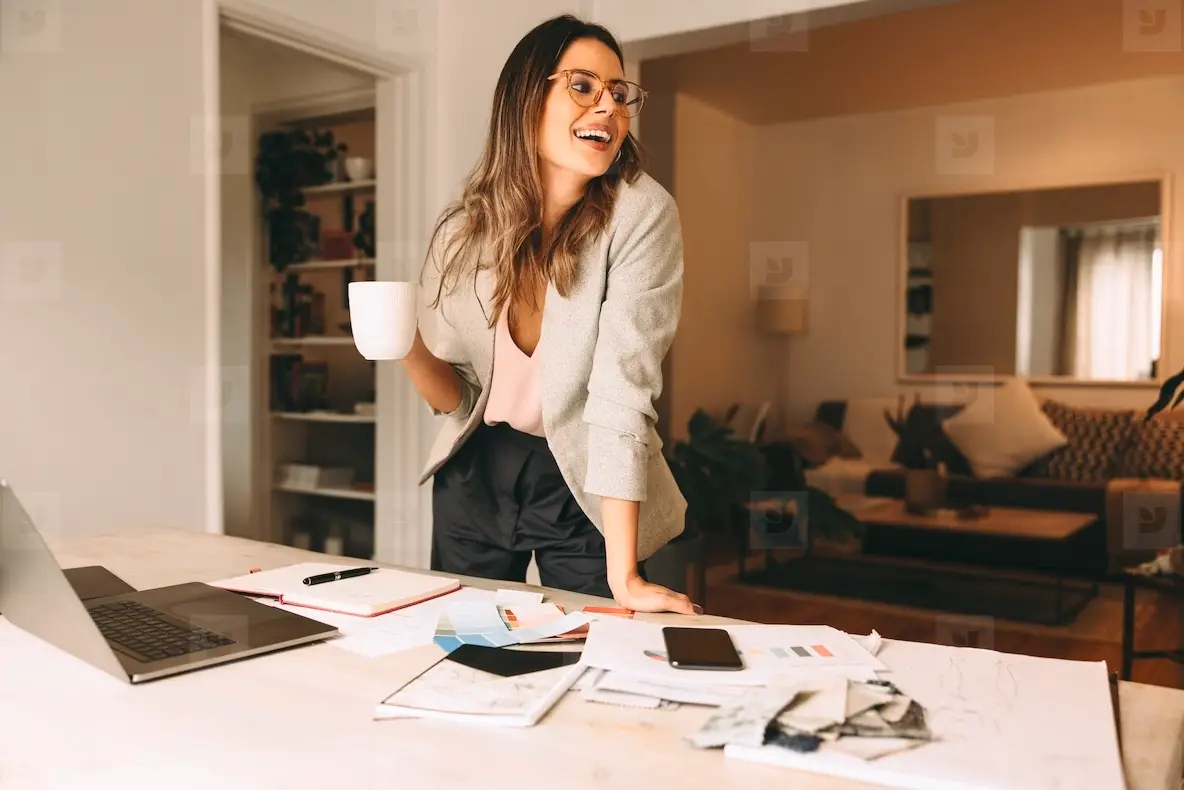 Design Professional Taking A Coffee Break In Her Home Office Photo ...