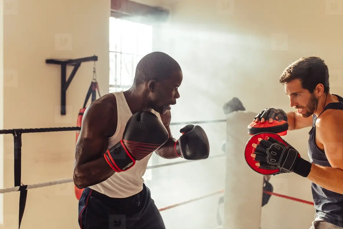 Boxing Instructor Training A Young Fighter In A Gym Photo (259069 ...