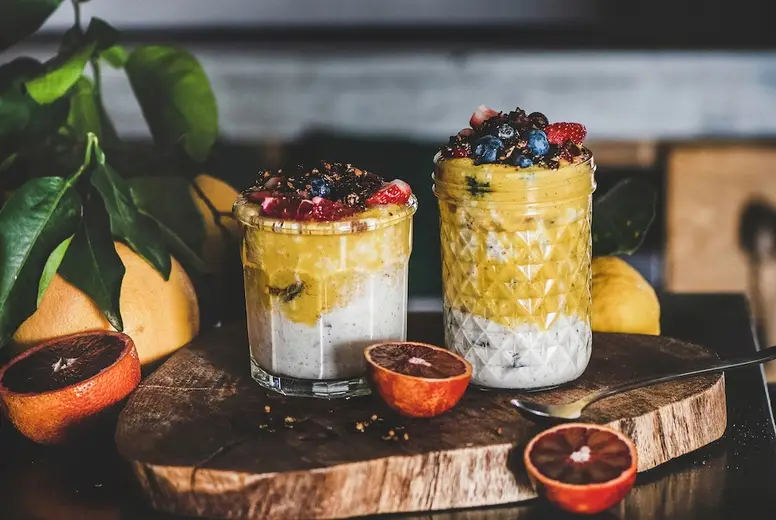 Muesli With Mango Smoothie, Buckwheat Granola And Fresh Berries Photo ...
