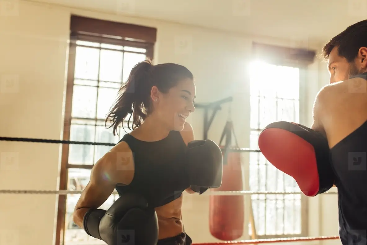 Happy Female Boxer Sparring With Instructor Photo (264032) - YouWorkForThem