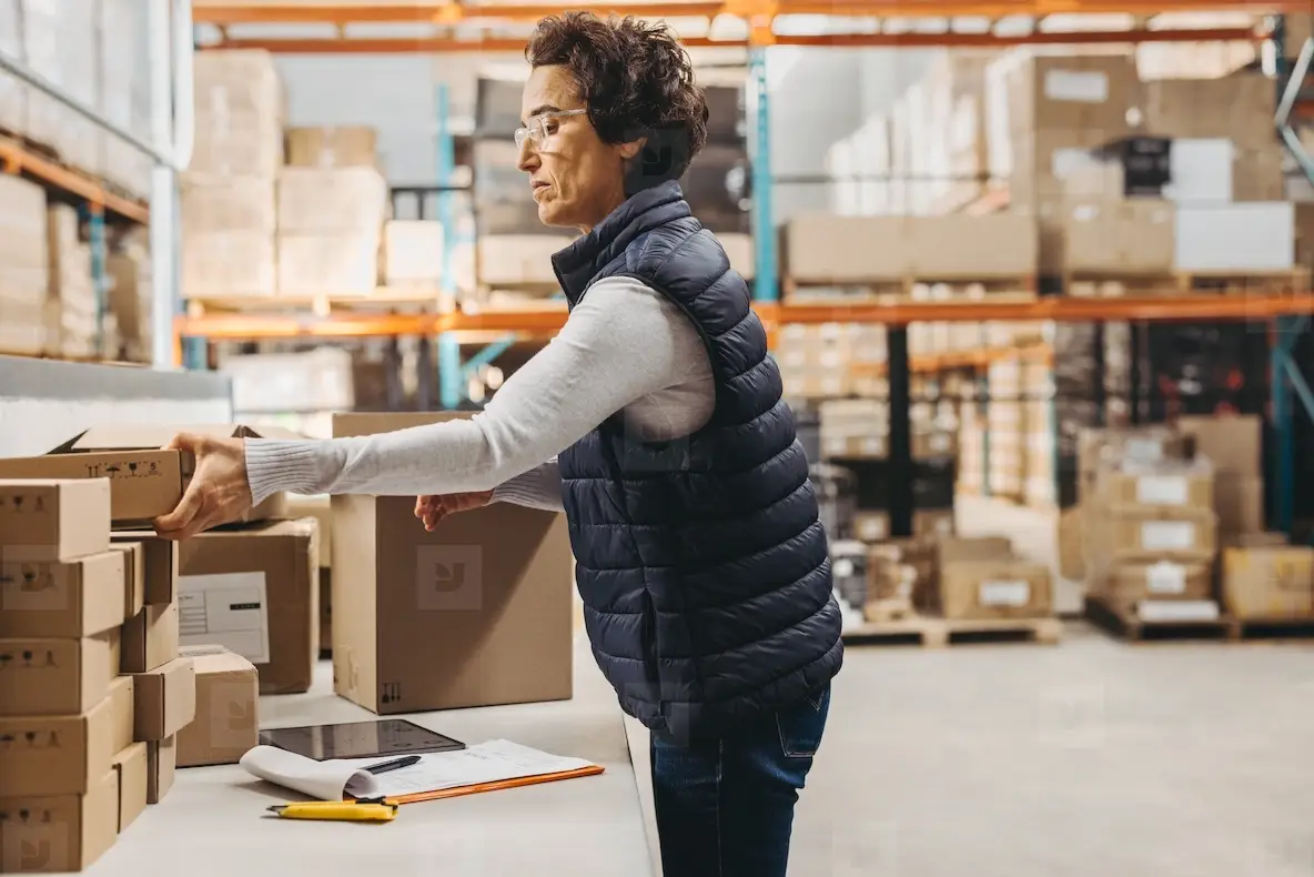 Female Warehouse Worker Packing Cardboard Boxes Photo (264411 ...