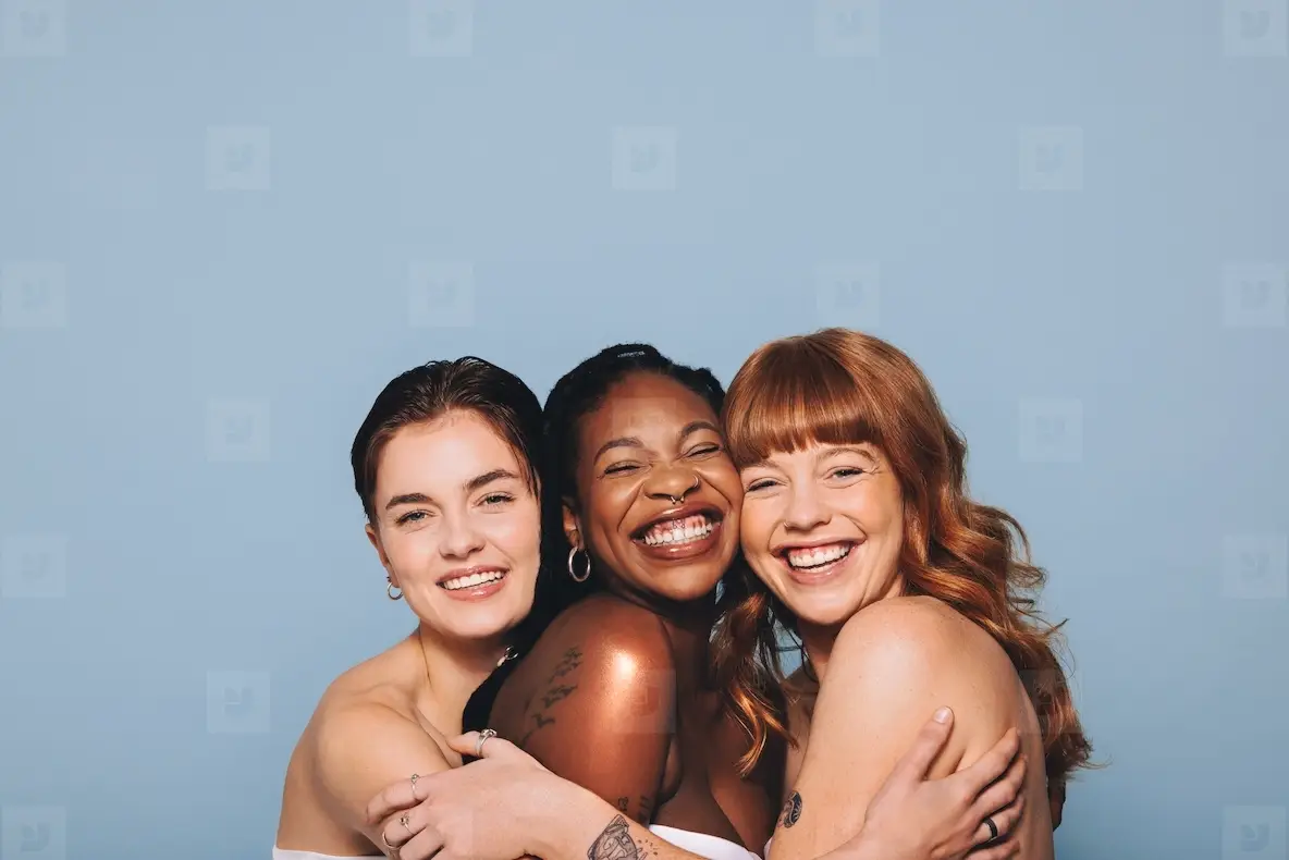 Three Women With Different Skin Tones Embracing Each Other Photo ...