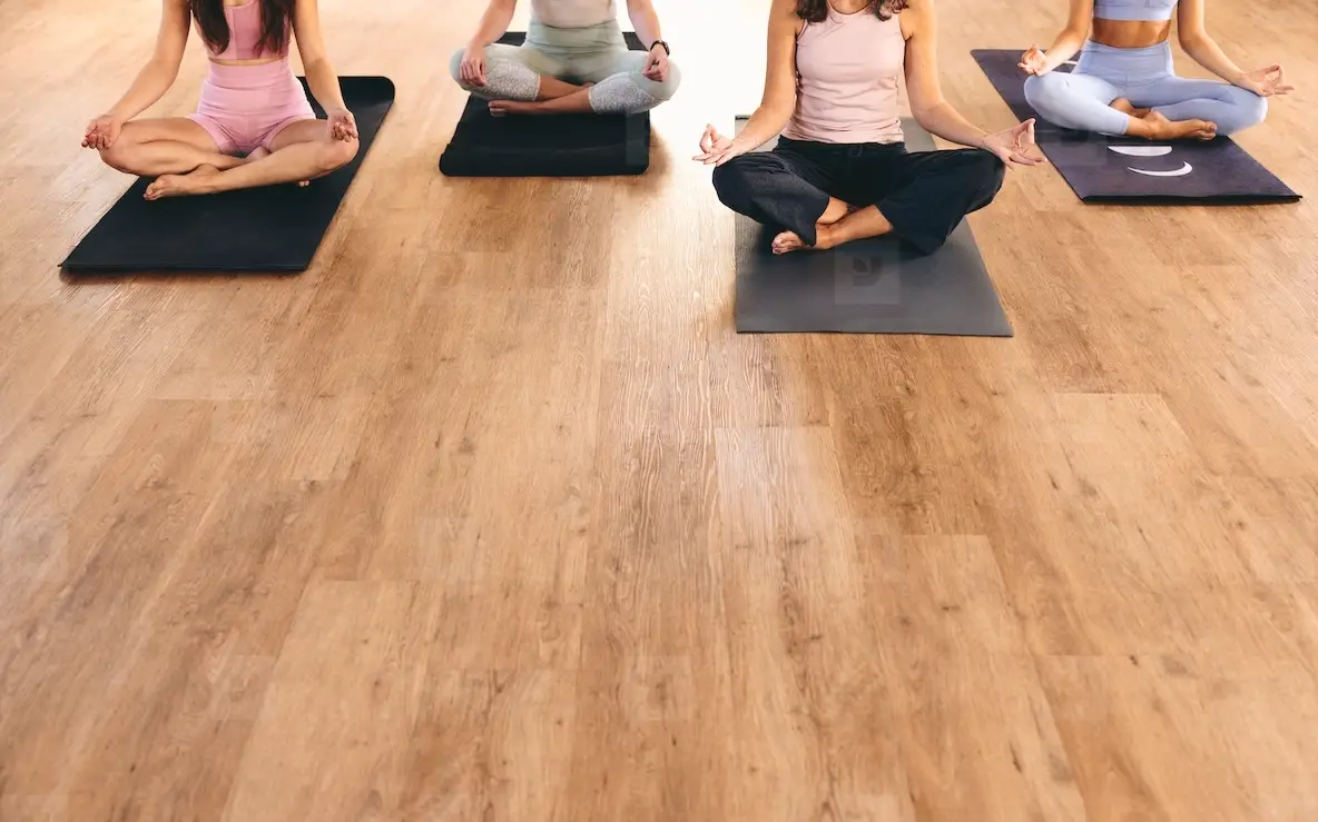 Group Of Women Doing Easy Pose Meditation During A Yoga Class Photo ...