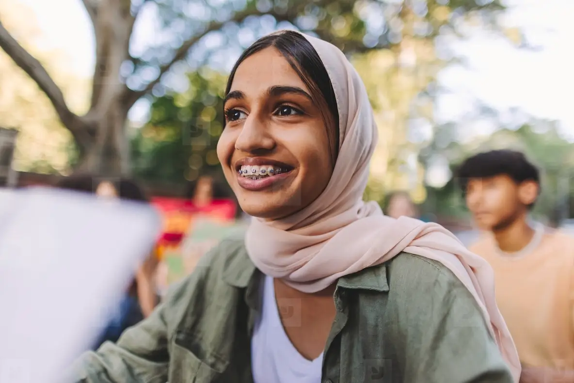 Muslim Girl Smiling Happily At A Climate Protest Photo (266776 ...