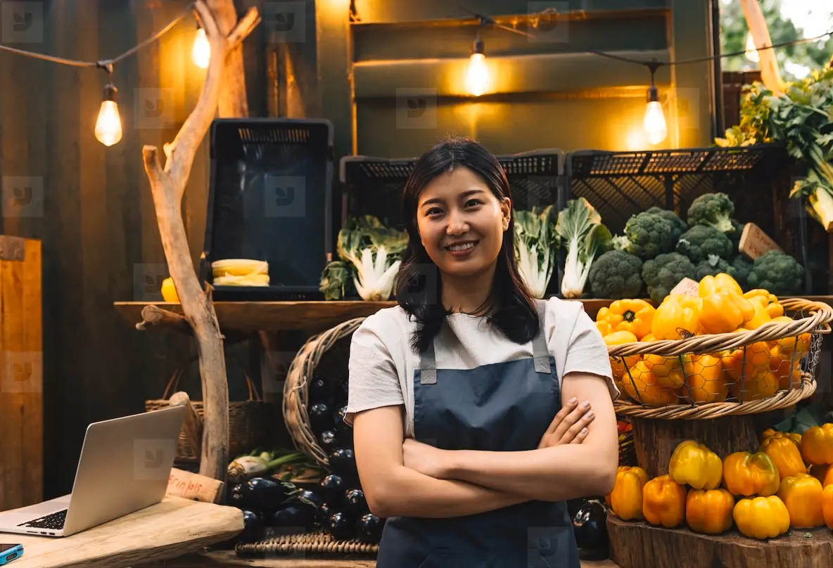 Portrait Of An Outdoor Market Owner. Asian Woman With Crossed Arms ...